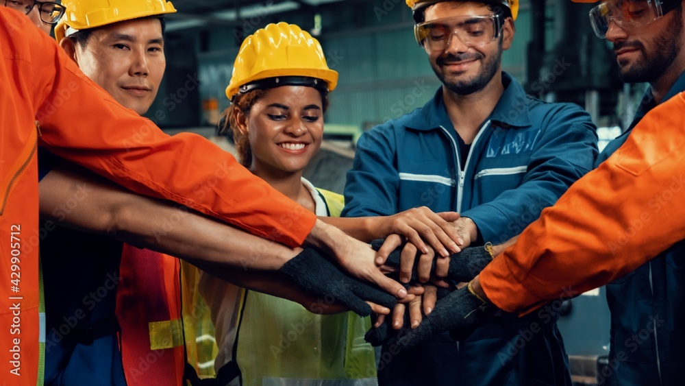 Skillful worker stand together showing teamwork in the factory ...
