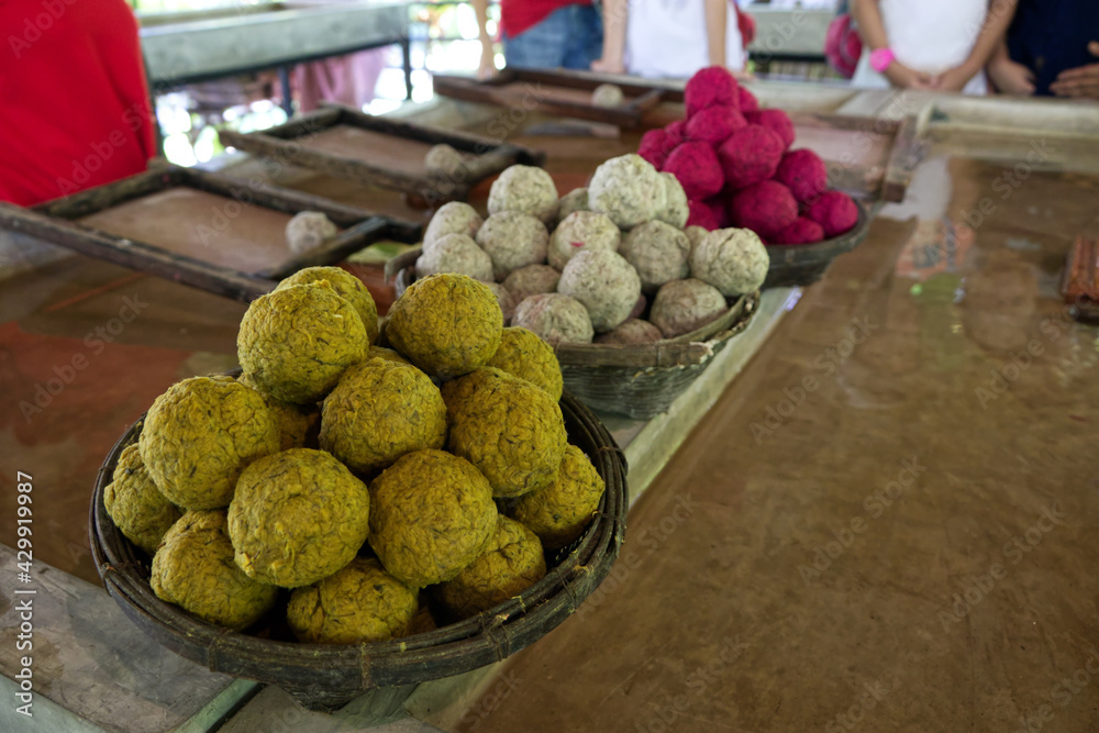Elephant poo balls dyed in colors in baskets, waiting for students and ...