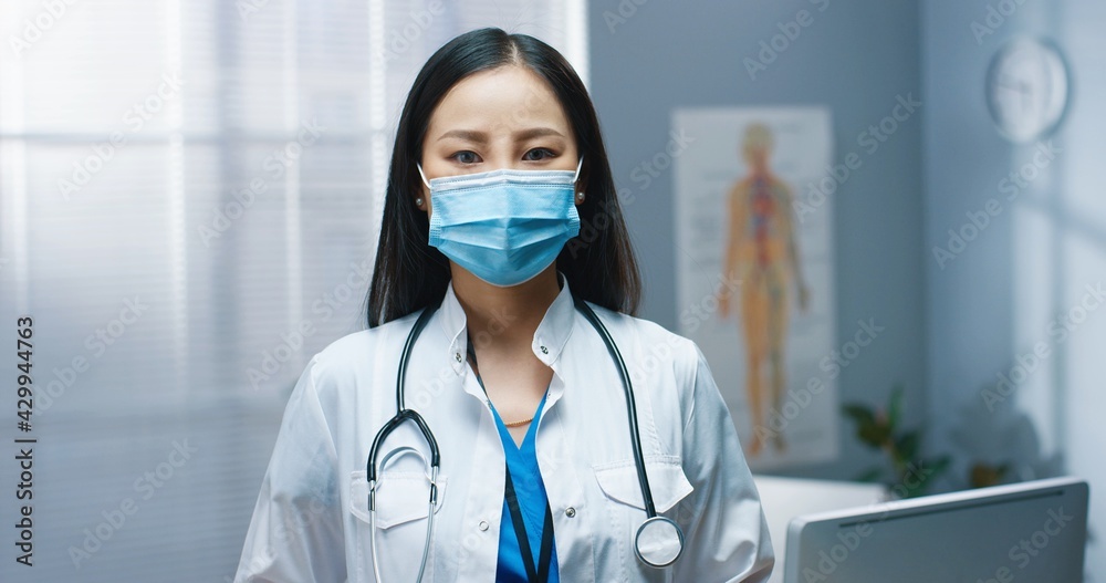 Close up of Asian young beautiful woman general practitioner wearing ...