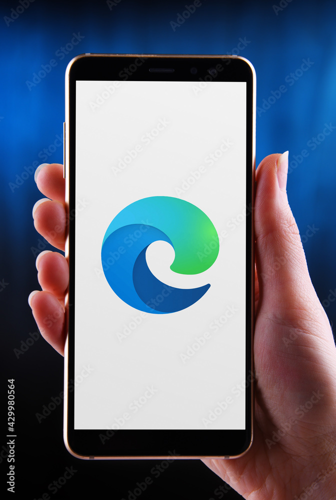 Hand holding smartphone displaying logo of Microsoft Edge Stock Photo ...