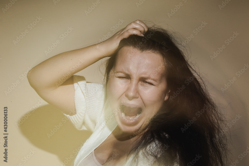Young woman suffering from a severe depression or anxiety disorder ...