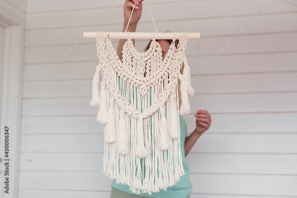 woman hold handmade macrame panel Stock Photo | Adobe Stock