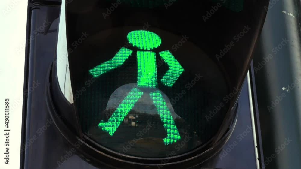 Pedestrian traffic lights, green light blinking and turning off, city ...