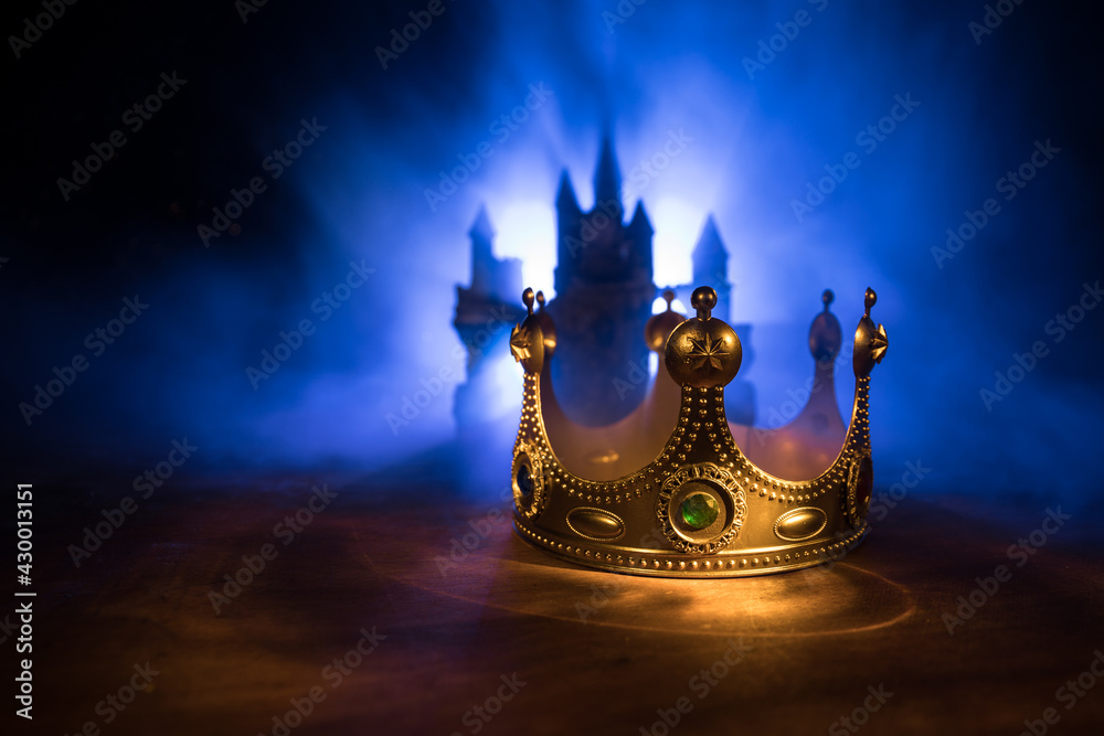 low key image of beautiful queen/king crown over wooden table. vintage ...