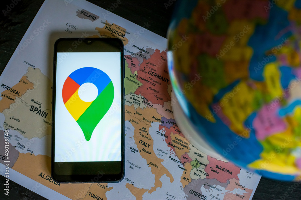 Mobile With The Logo Of The Google Maps Application. The Mobile Is On ...