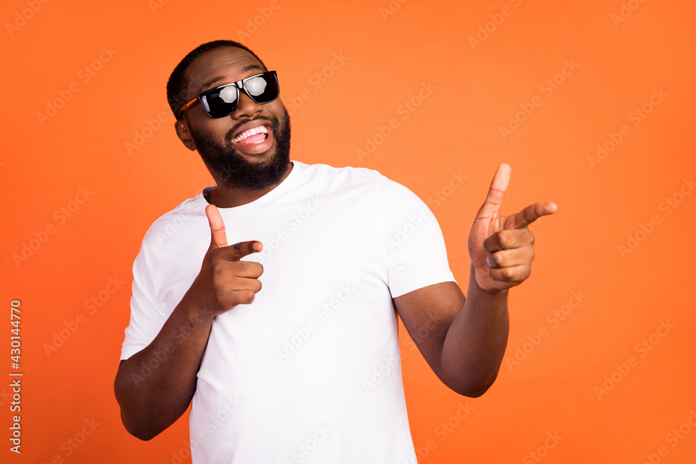 Portrait of attractive cheerful cool guy wearing specs pointing at you ...