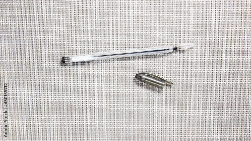 Stop motion animation. Picking up and twisting a ballpoint pen. A rod ...