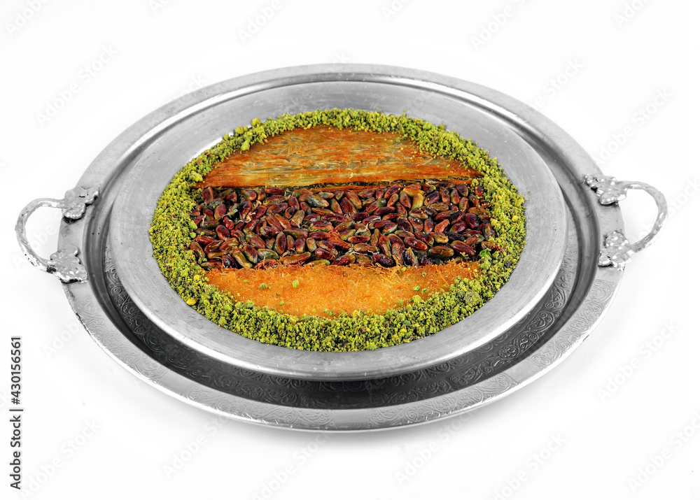 Turkish dessert kunefe, kunafa, kadayif with pistachio powder and ...