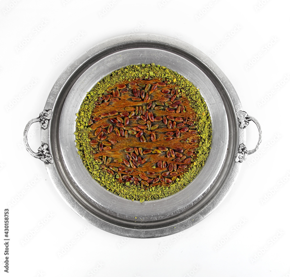 Turkish dessert kunefe, kunafa, kadayif with pistachio powder and ...