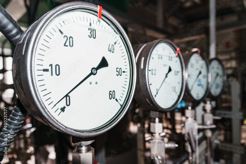 Pressure gauge is a close-up pressure measuring device in a row. Stock ...