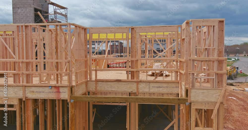 Framing of under construction wooden house building frame structure on ...