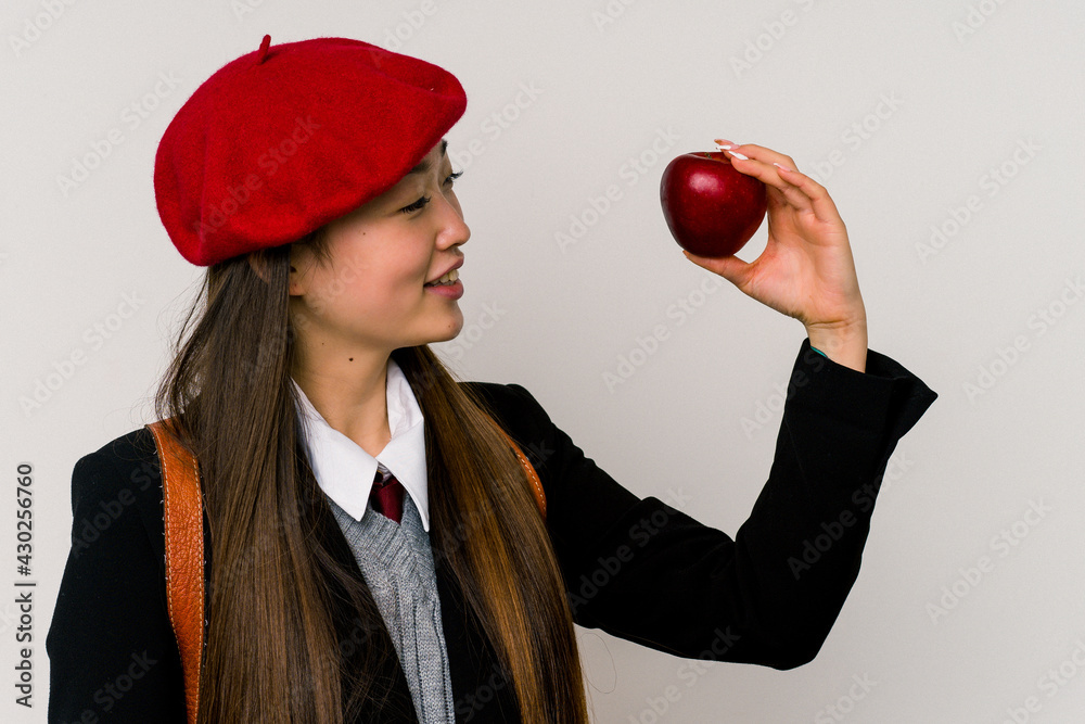 Young chinese woman wearing a school uniform isolated on white ...