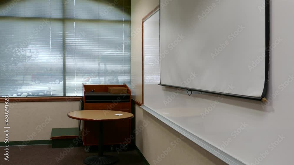 Modern classroom with white board visual aid and projection screen ...