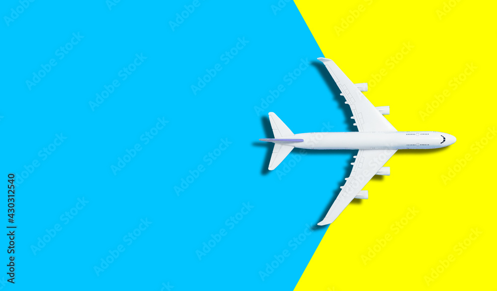 Flat lay design of travel concept with plane on blue and yellow ...