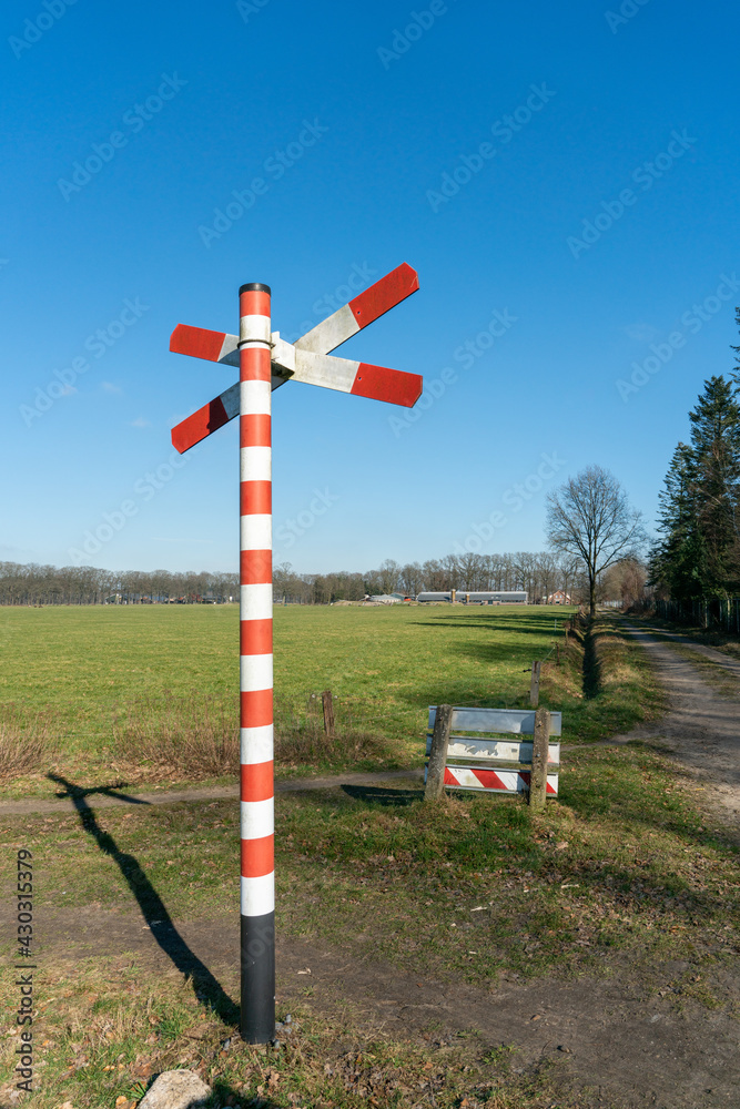 Railroad crossing sign near Loenen in The Netherlands on the track of V ...