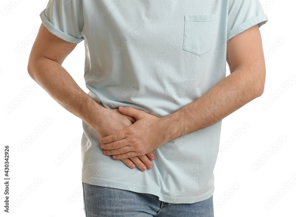 Man suffering from acute appendicitis on white background, closeup ...