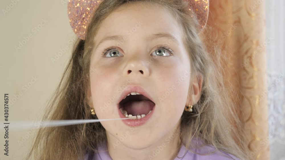 Deciduous teeth. Failed attempt to remove a first tooth at home. Scared ...