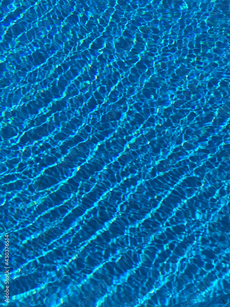 Phone photography of abstract ripped blue water in swimming pool with ...