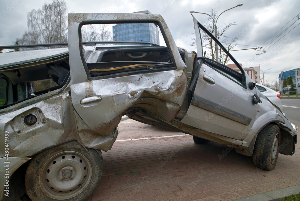 Deadly car crash. Ruined passenger car crashes into pole, broken ...
