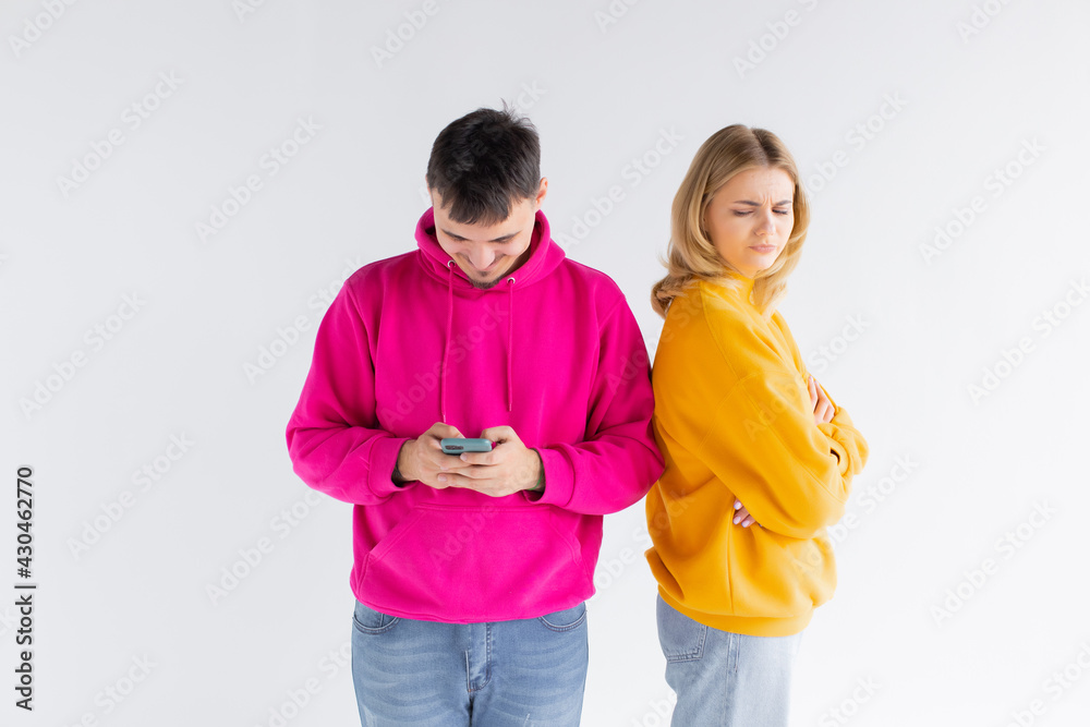 Fighting couple at home while woman shouting on man who holding ...