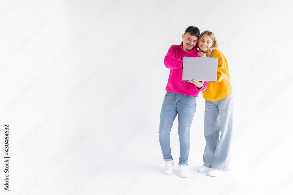 Full length image of excited couple man and woman rejoicing while ...