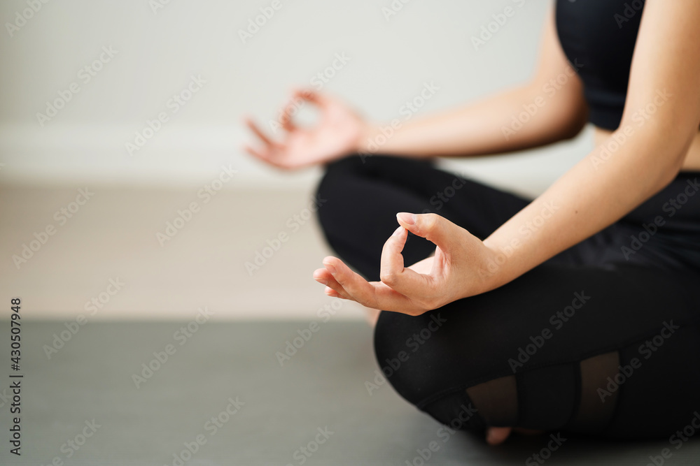 side view of young women practicing yoga the easy sitting pose ...
