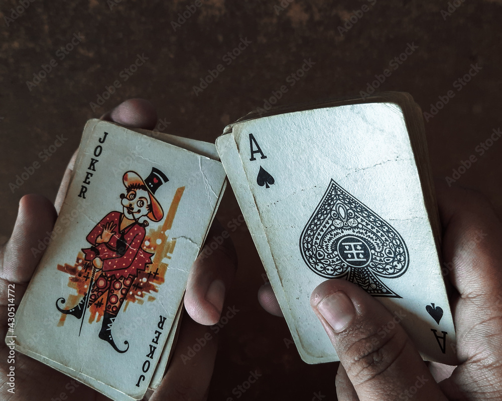 Ace of spades and Joker in deck of playing cards Stock Photo | Adobe Stock