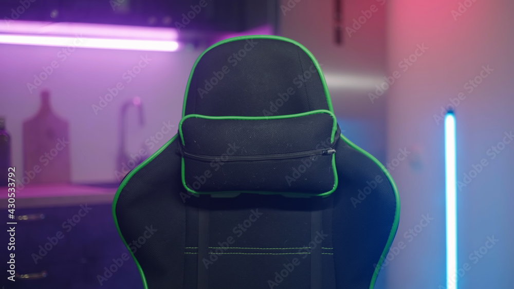 Empty gaming chair with colorful kitchen in background Stock Photo ...