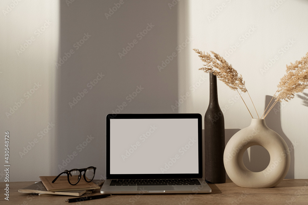 Aesthetic home office desk workspace with sunlight shadows on the wall ...