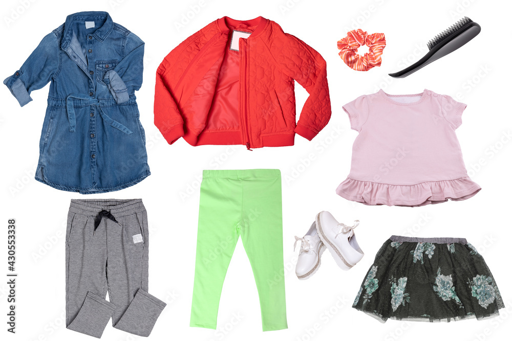 Collage set of little girl clothes isolated on a white background. The ...