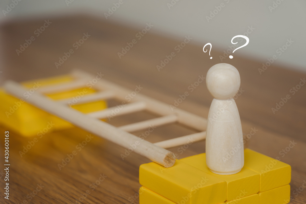 Symbol Business people model stand on wooden wall between ladder with ...