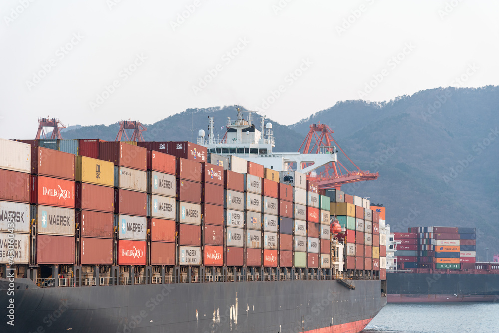 Cargo container ship in sea port of Busan, she is departing from ...