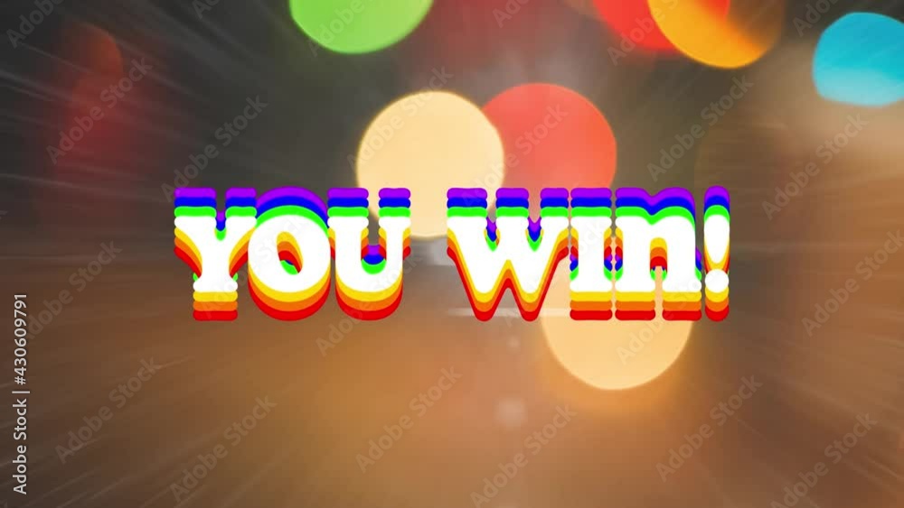 Animation of you win text in rainbow colours over colourful spots on ...