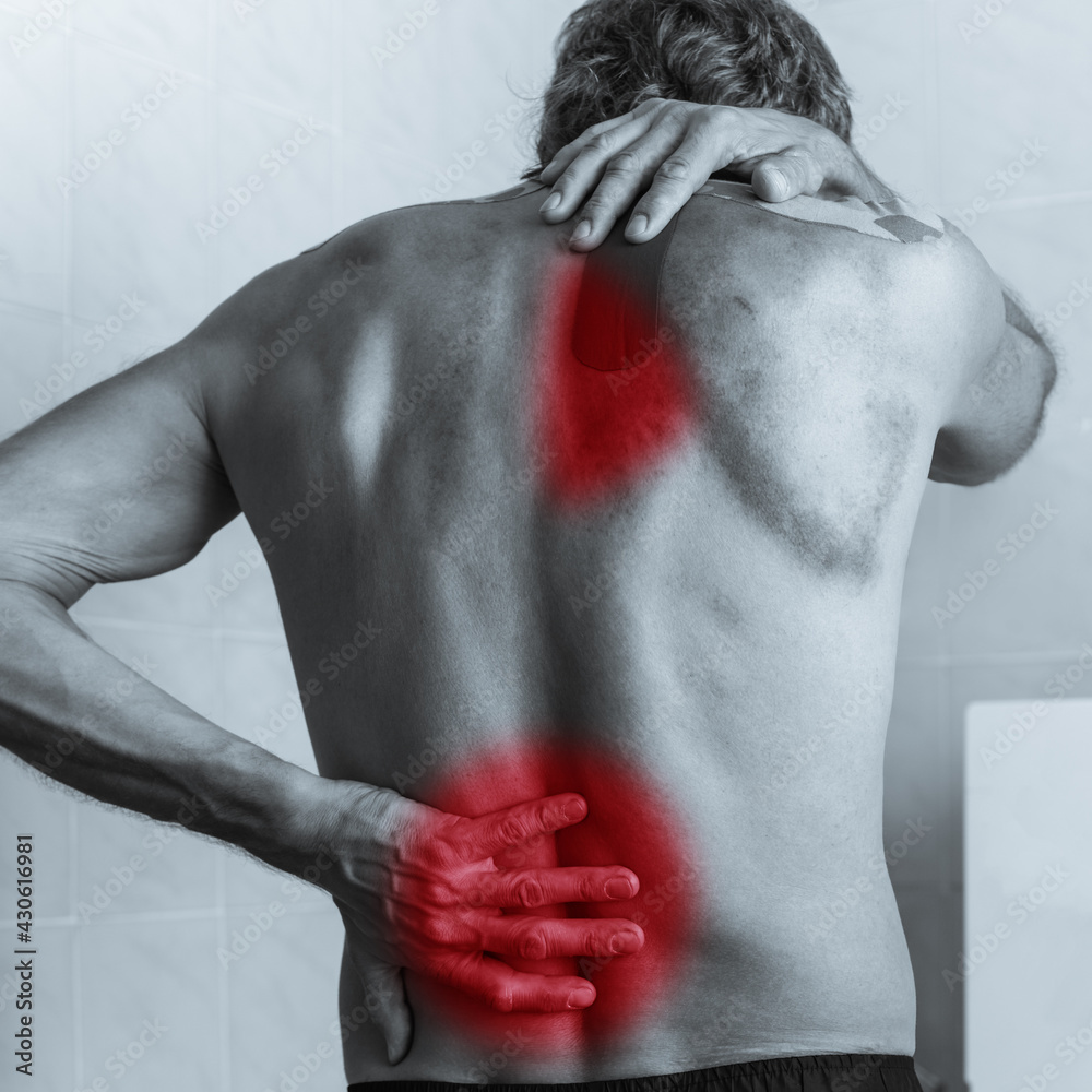 Back view of shirtless man with lower back pain, black and white photo ...