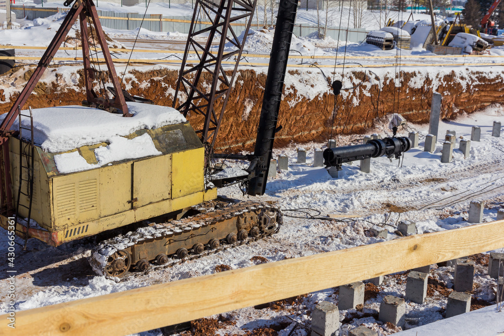 Hammer from a piling machine. Pile driving machine. Pile driving ...