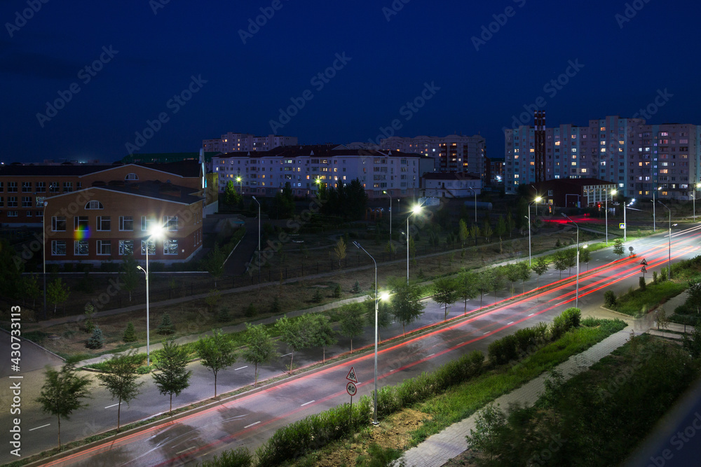 Tole bi street in the city of Uralsk, Kazakhstan. Night street lighting ...