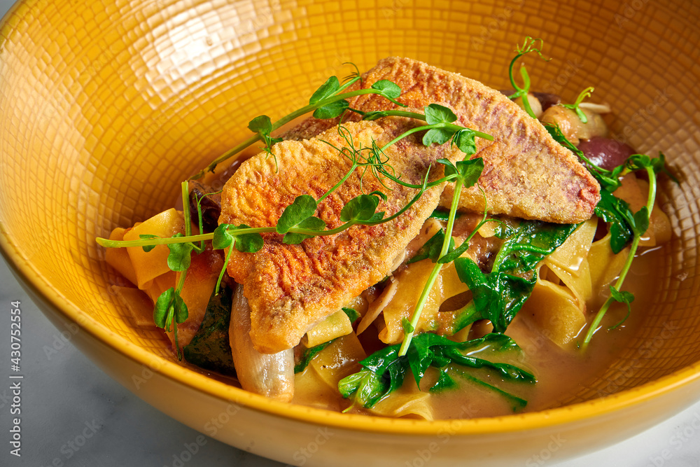 Pappardelle pasta with fried red mullet, barbule and microgrine in a ...