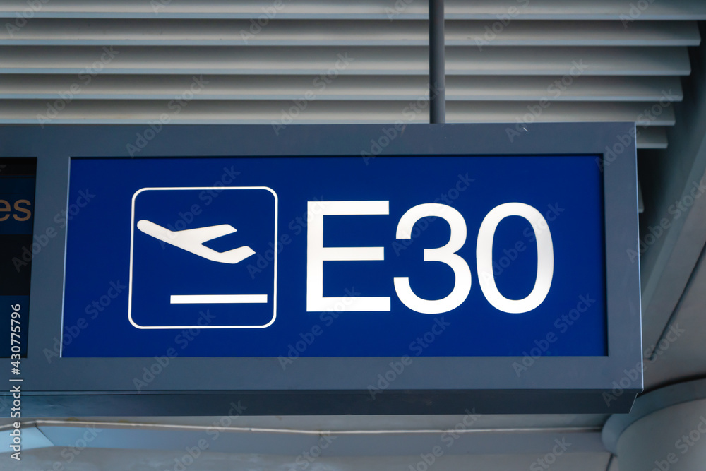 Airport Boarding gate entrance number sign board in departure area ...