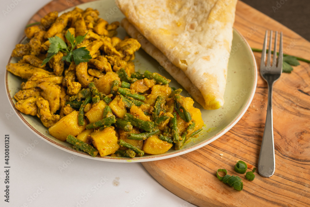 Indian-surinamese spicy food lunch and dinner roti chicken curry meal ...