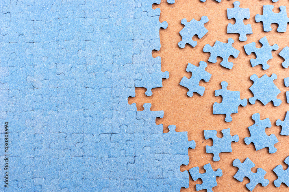 Blue jigsaw puzzle with copy space. Connected and missing blank puzzle ...
