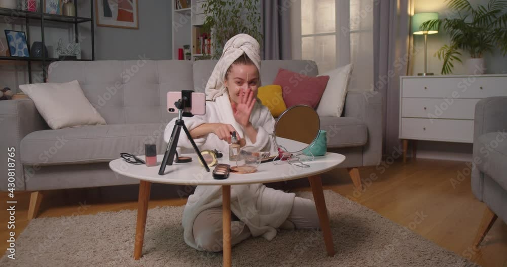 Middle plan of makeup young woman vlogger influencer creating cosmetic ...