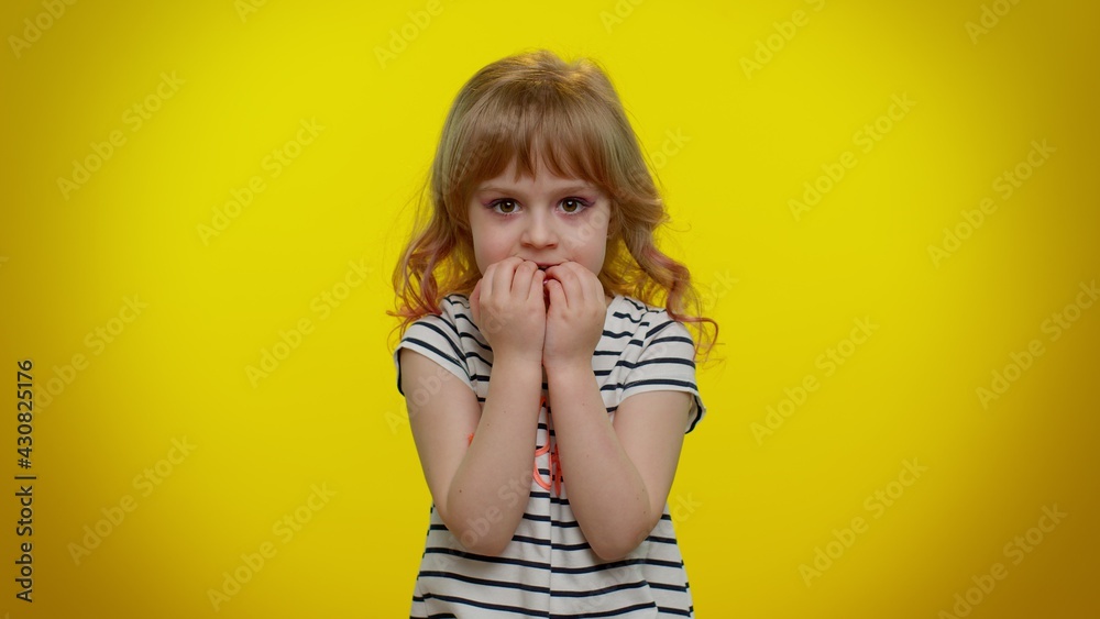 Upset scared frightened child girl biting nails, feeling worried ...