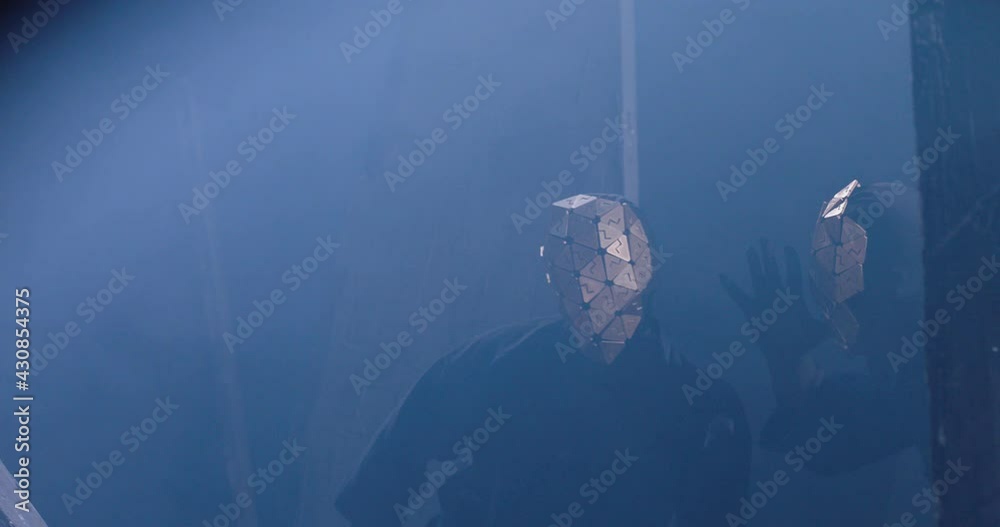 Mystic footage of metal masked man . Epic scene of people with triangle ...