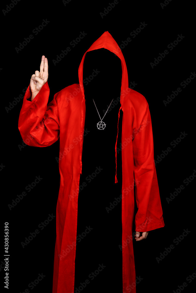 Person in red cloak pointing up with fingers. Scary figure in mantle ...