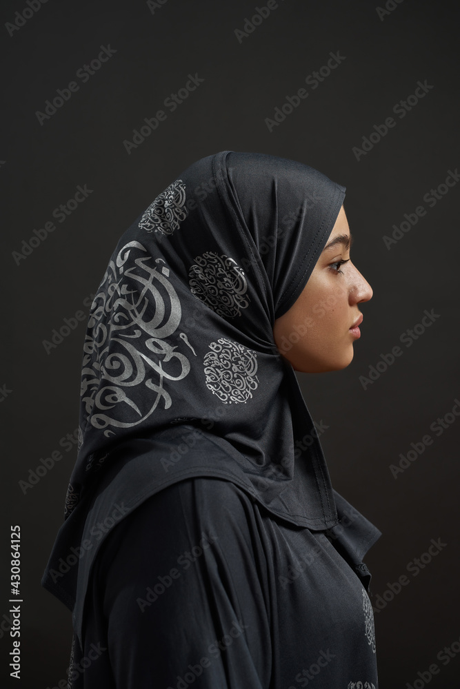 Profile of young arabic girl in traditional hijab Stock Photo | Adobe Stock