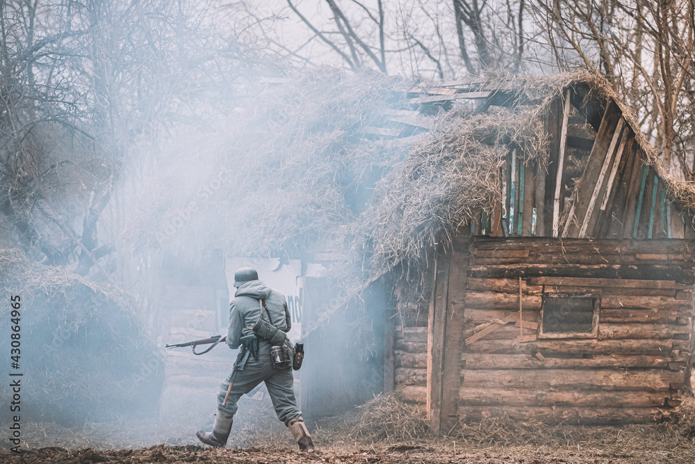 German Wehrmacht Infantry Soldier In WW II Running On Battlefield Near ...