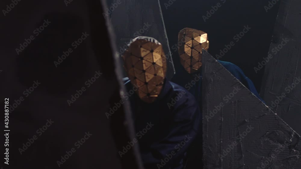 Mystic footage of metal masked man . Epic scene of people with triangle ...