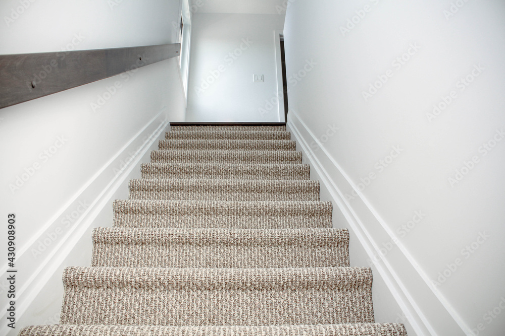 Top view of Staircase in the modern house with brown carpet, walk ...