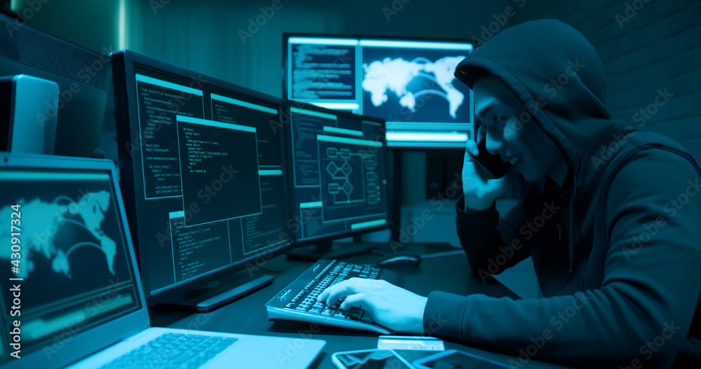 Asian male hacker extorting Stock 写真 | Adobe Stock