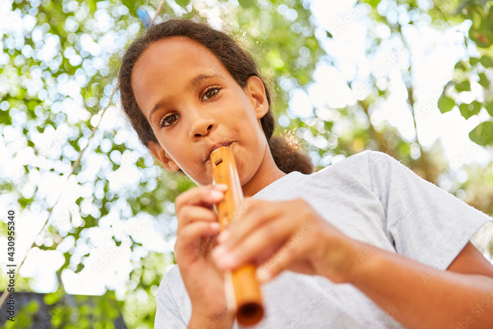 Girls with music talent practicing playing the flute Stock Photo ...